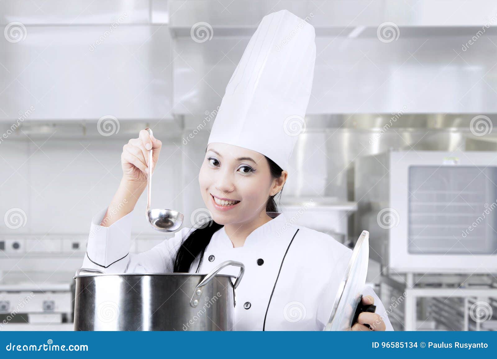 Female Chef Cooking with Pot in Kitchen Stock Photo - Image of ...