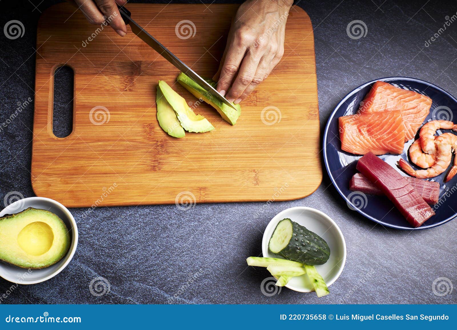 Female Chef Cutting an Avocado To Make Sushi. Asian Food Concept Stock ... Female Chef Cutting an Avocado To Make Sushi. Asian Food Concept Stock ...