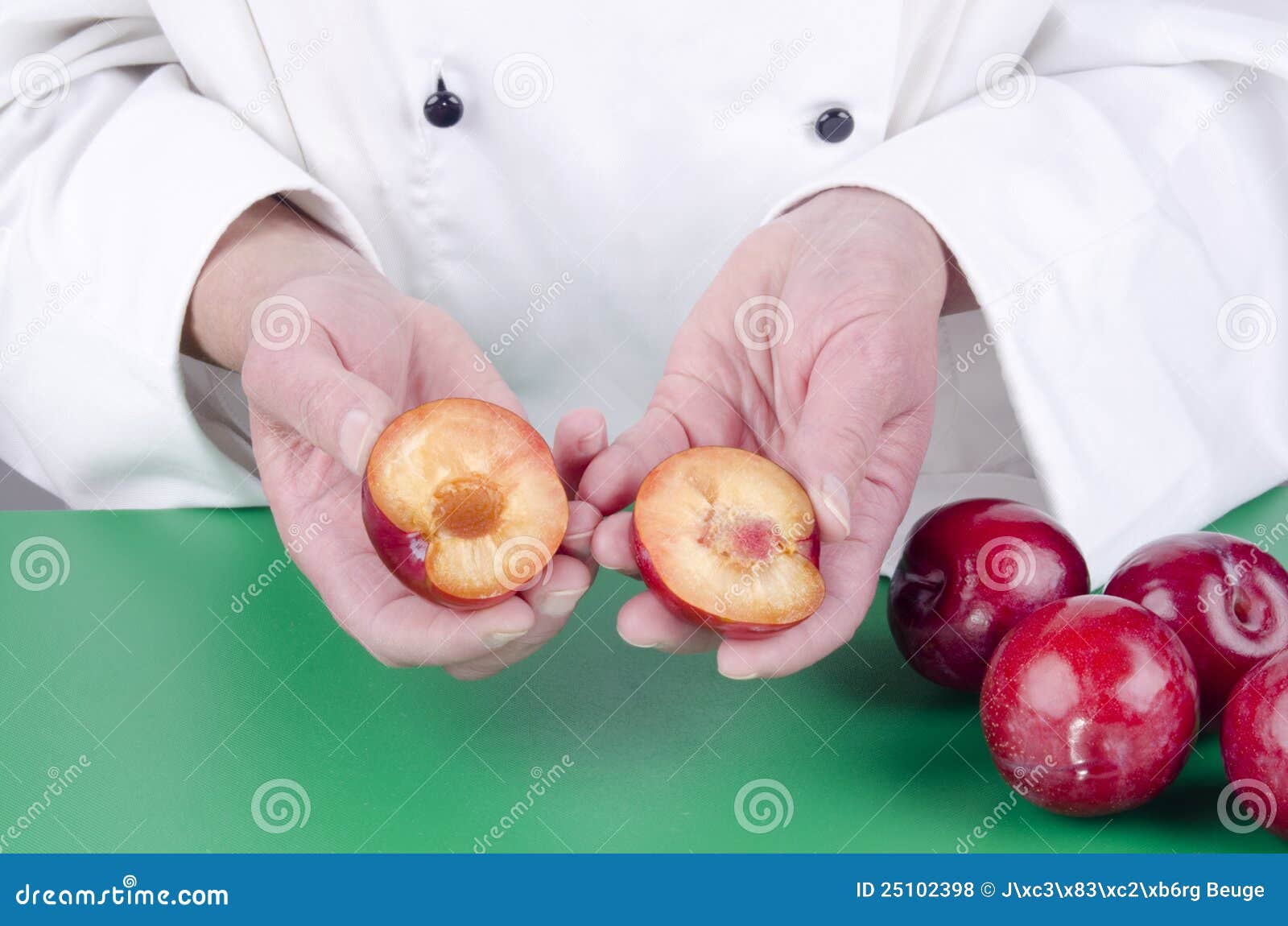 Female Chef with a Divided Plum Stock Photo - Image of brown, female ...