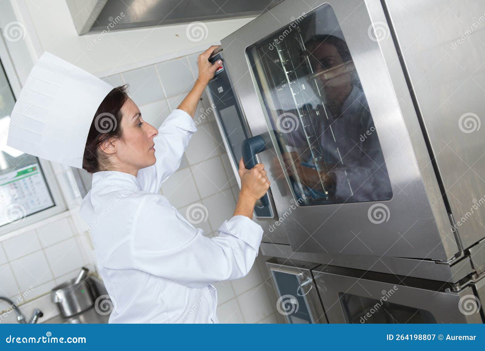 Female chef at door oven stock image. Image of confectioner - 264198807