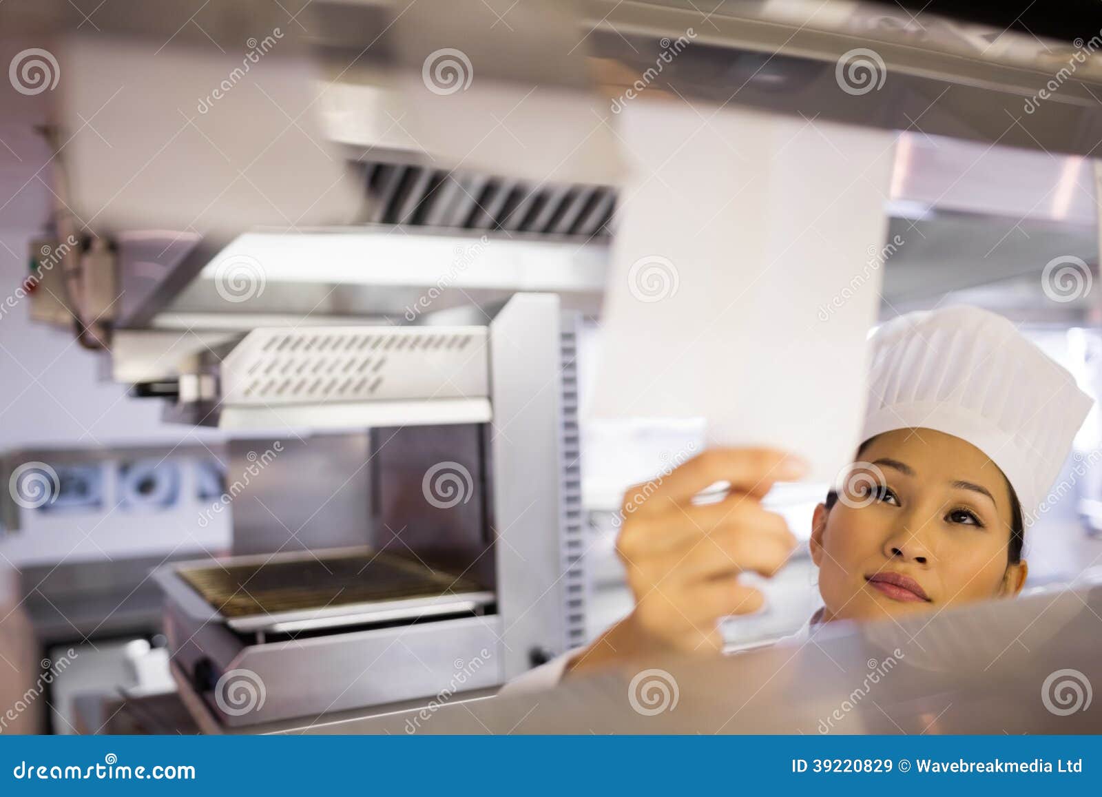 Female Chef Going through Cooking Checklist at Kitchen Stock Image ...