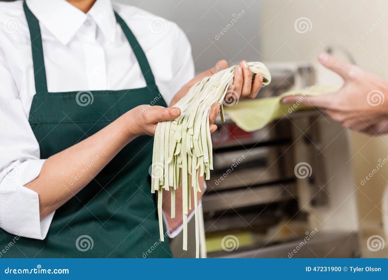 Female Chef Holding Spaghetti Pasta at Kitchen Stock Photo - Image of ...