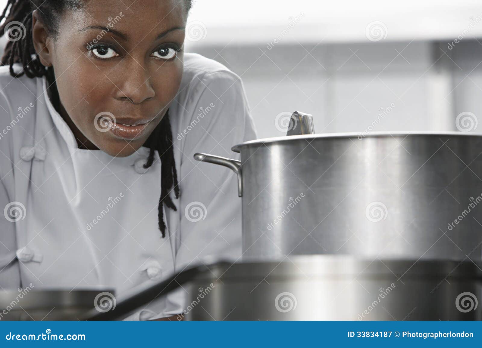 Female Chef in Kitchen stock image. Image of indoors - 33834187