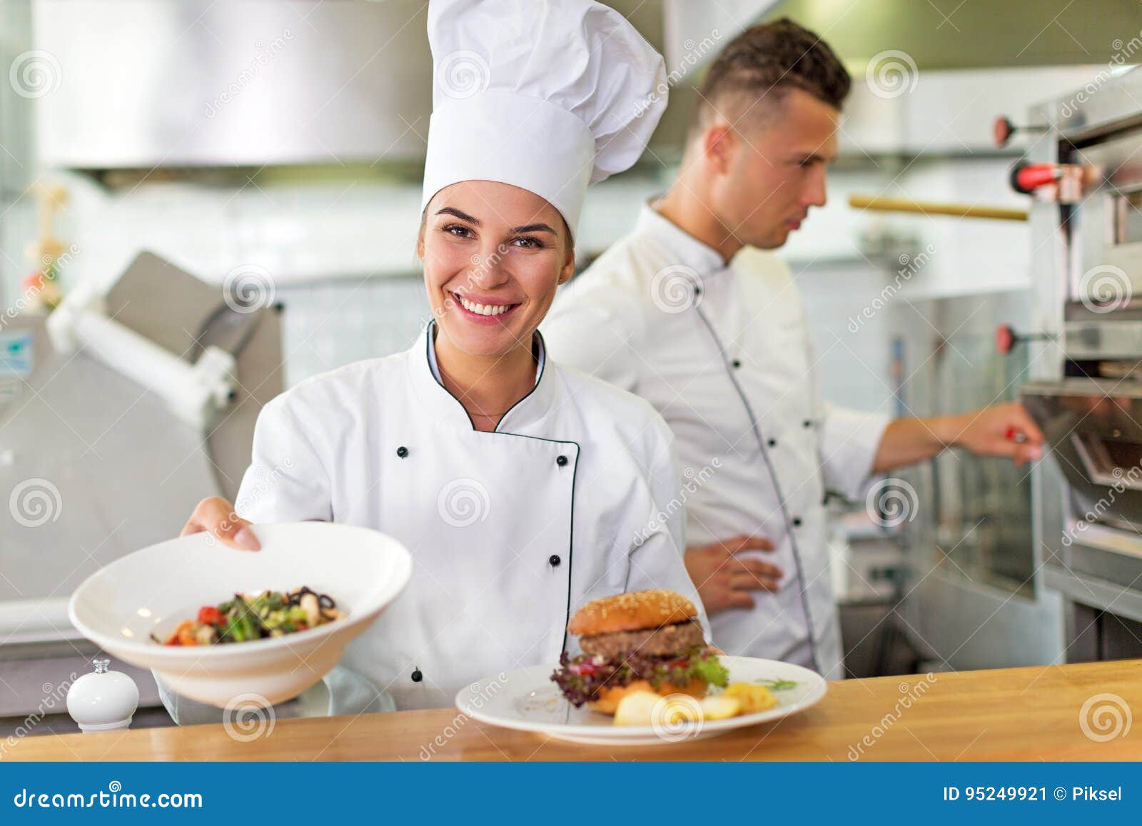 Female chef in kitchen stock image. Image of confident - 95249921
