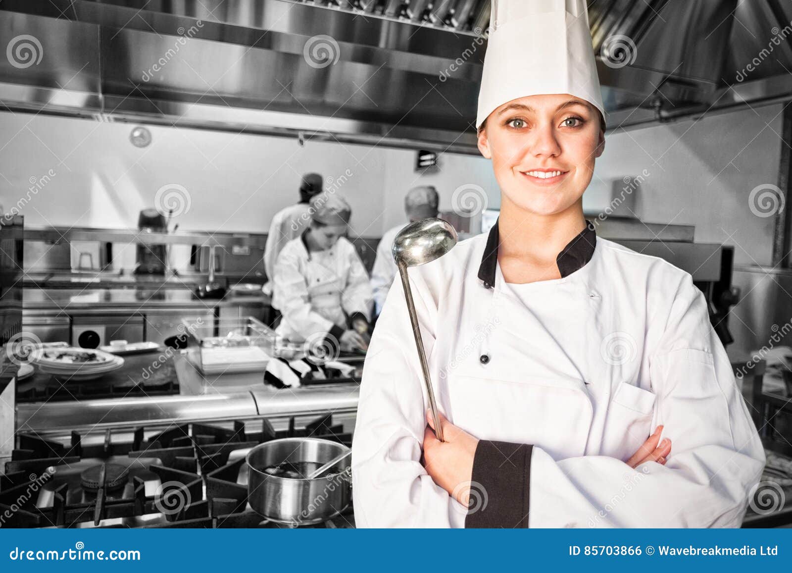 Female Chef with Ladle in Commercial Kitchen Stock Photo - Image of ...