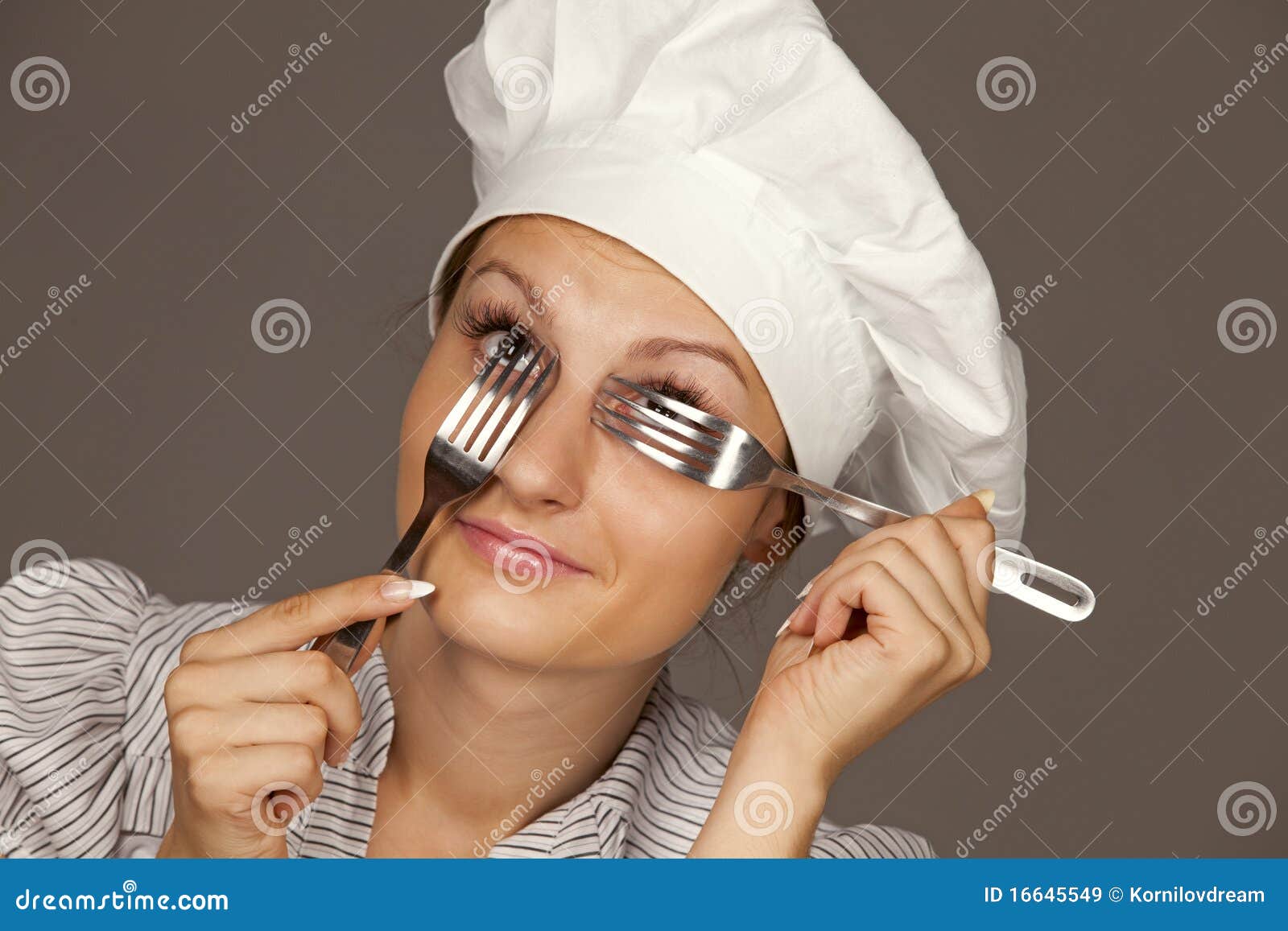 Female Chef Looking through Forks Stock Image - Image of cute, eyes ...