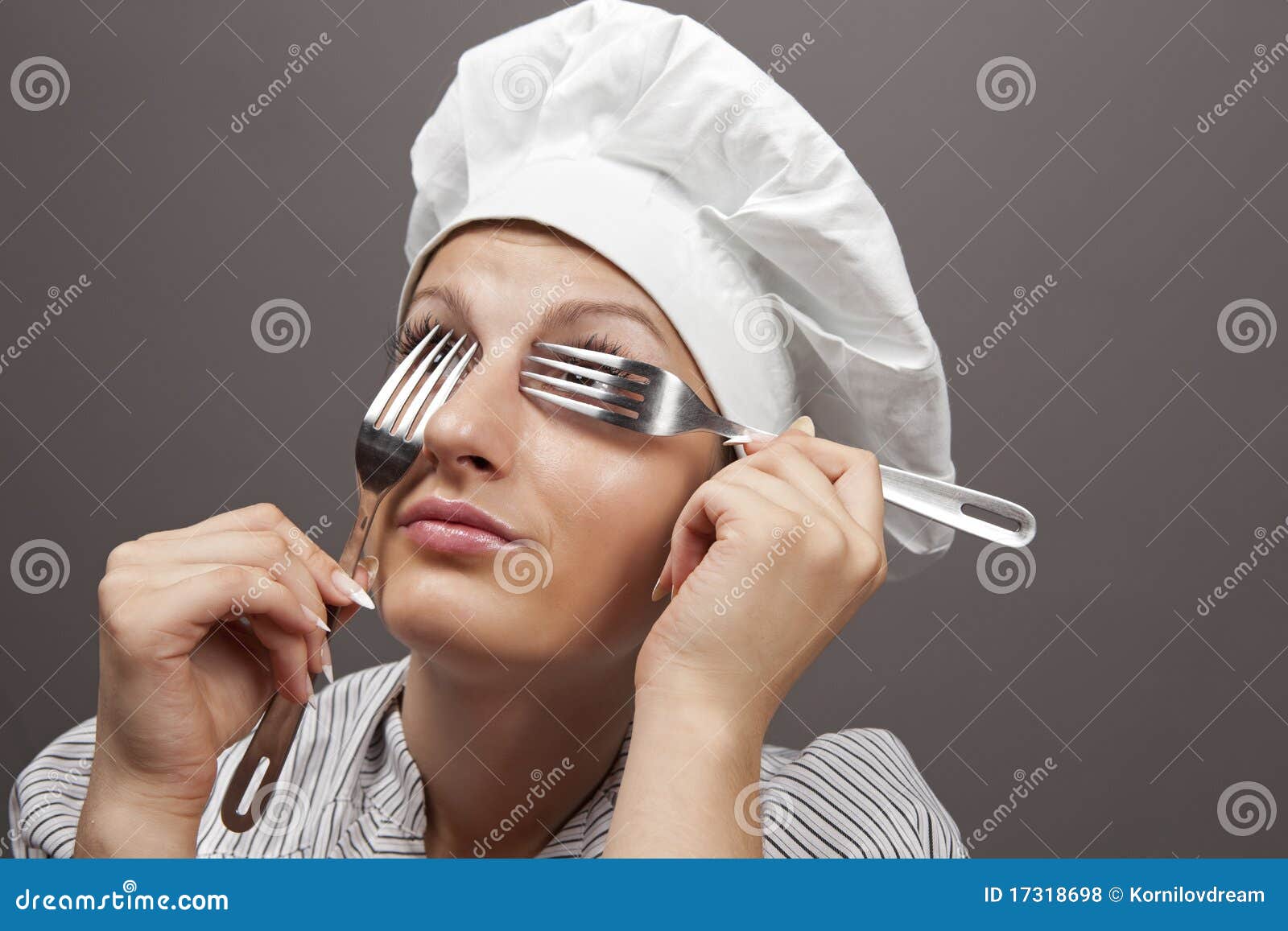 Female Chef Looking through Forks Stock Photo - Image of food ...