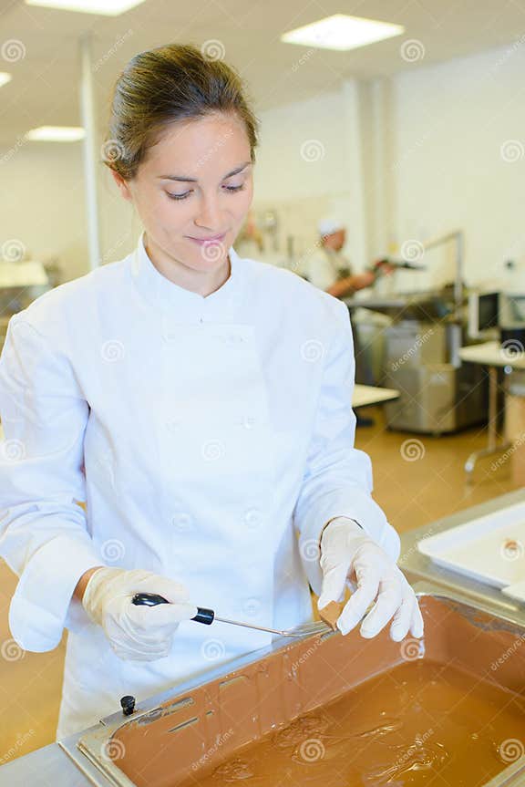 Female chef making caramel stock photo. Image of decor - 128022076