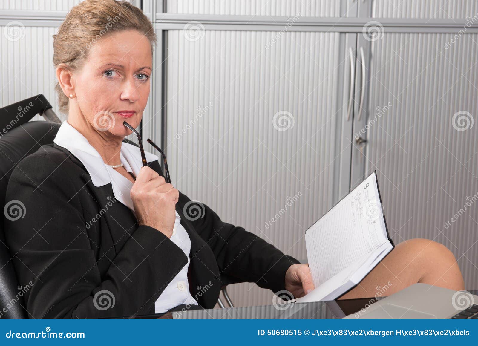 Female Chef in the Office Looking into Calendar Stock Image - Image of ...