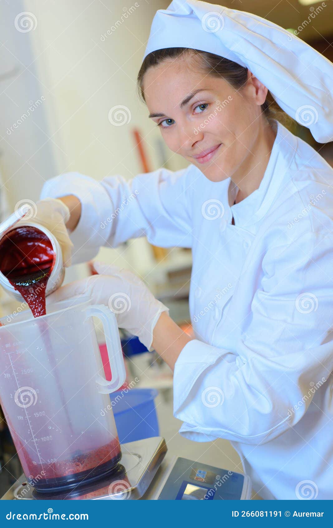 Female Chef Pouring Fruit Puree into Jug Stock Image - Image of gloves ...