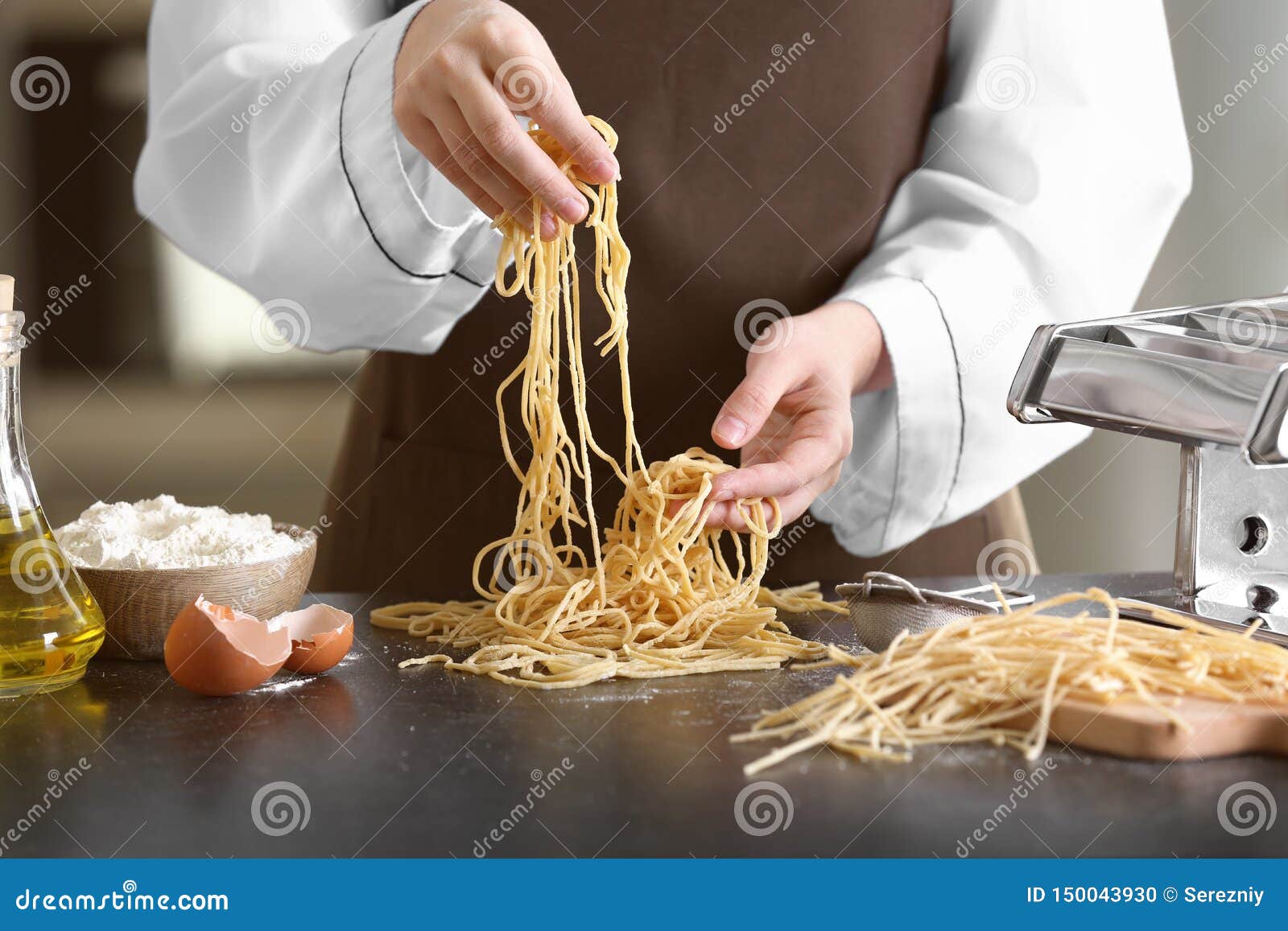Female Chef Preparing Pasta at Table Stock Photo - Image of homemade ...