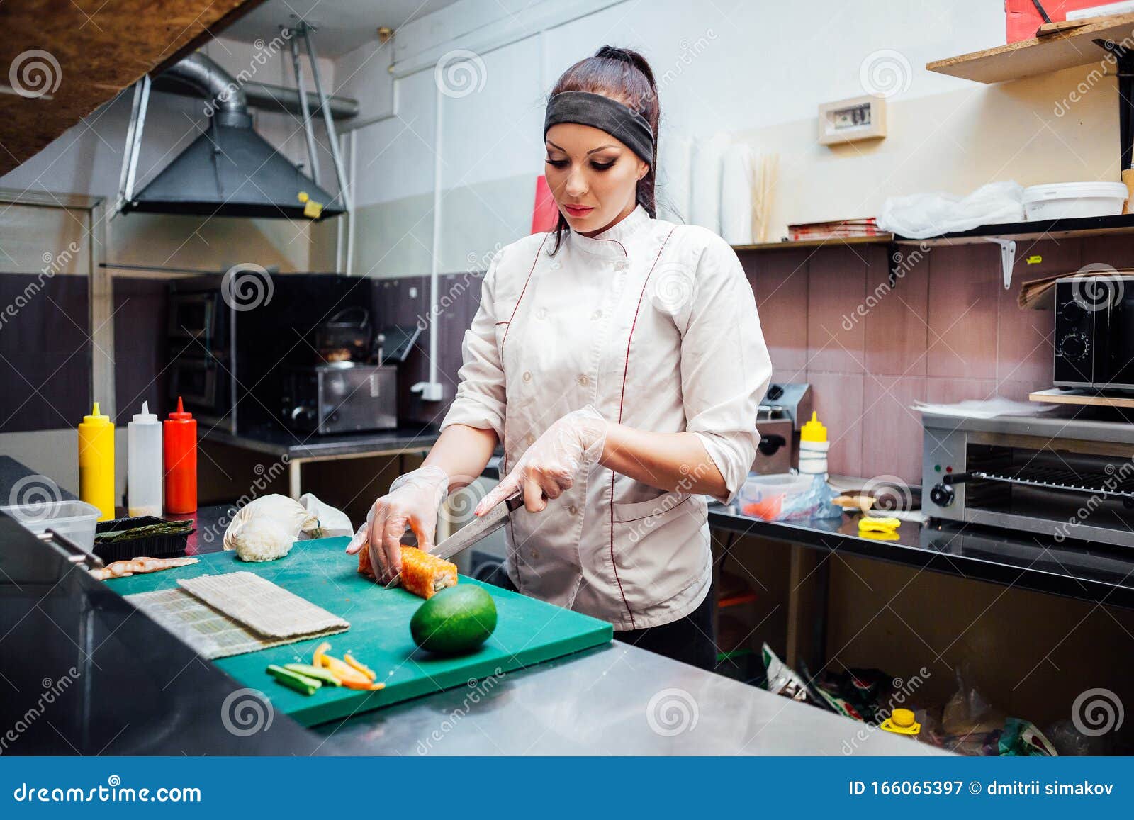 Female Chef Preparing a Sushi Restaurant in the Kitchen Stock Image ...