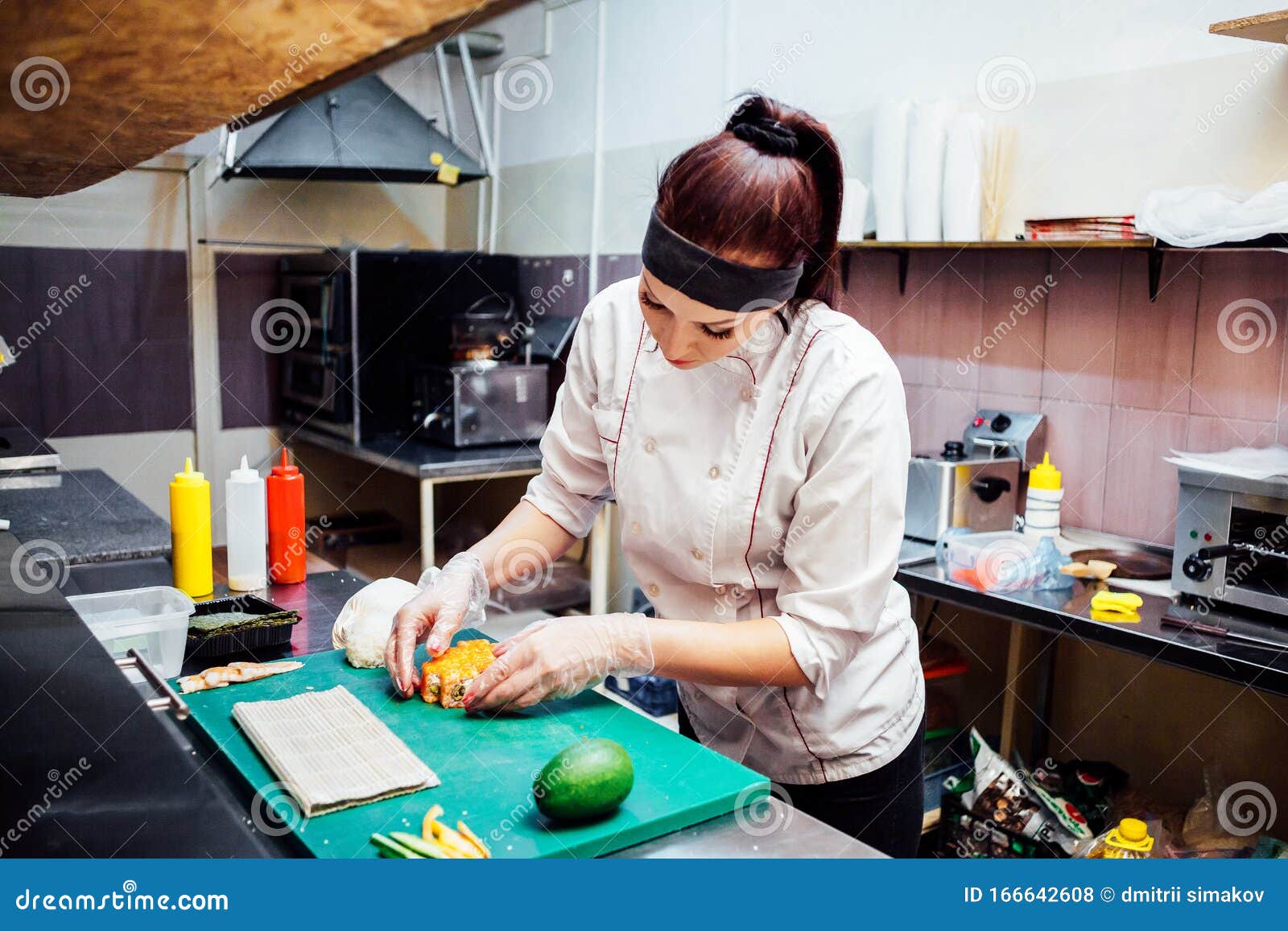 Female Chef Preparing a Sushi Restaurant in the Kitchen Stock Photo ...