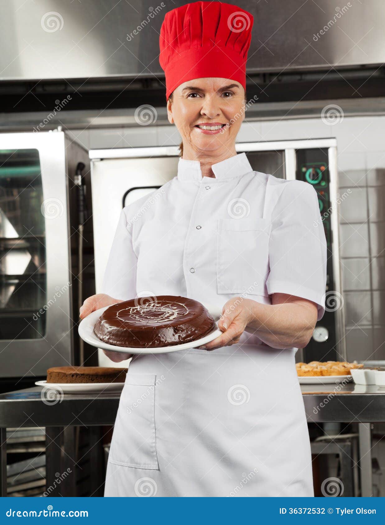 Female Chef Presenting Chocolate Cake Stock Photo - Image of occupation ...
