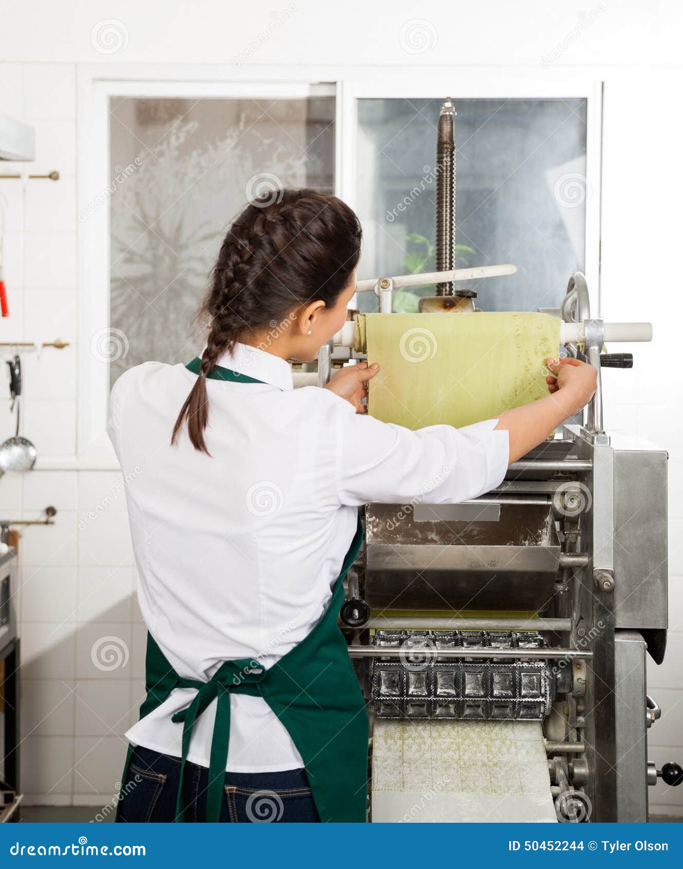 Female Chef Processing Pasta Sheet in Machine Stock Photo - Image of ...