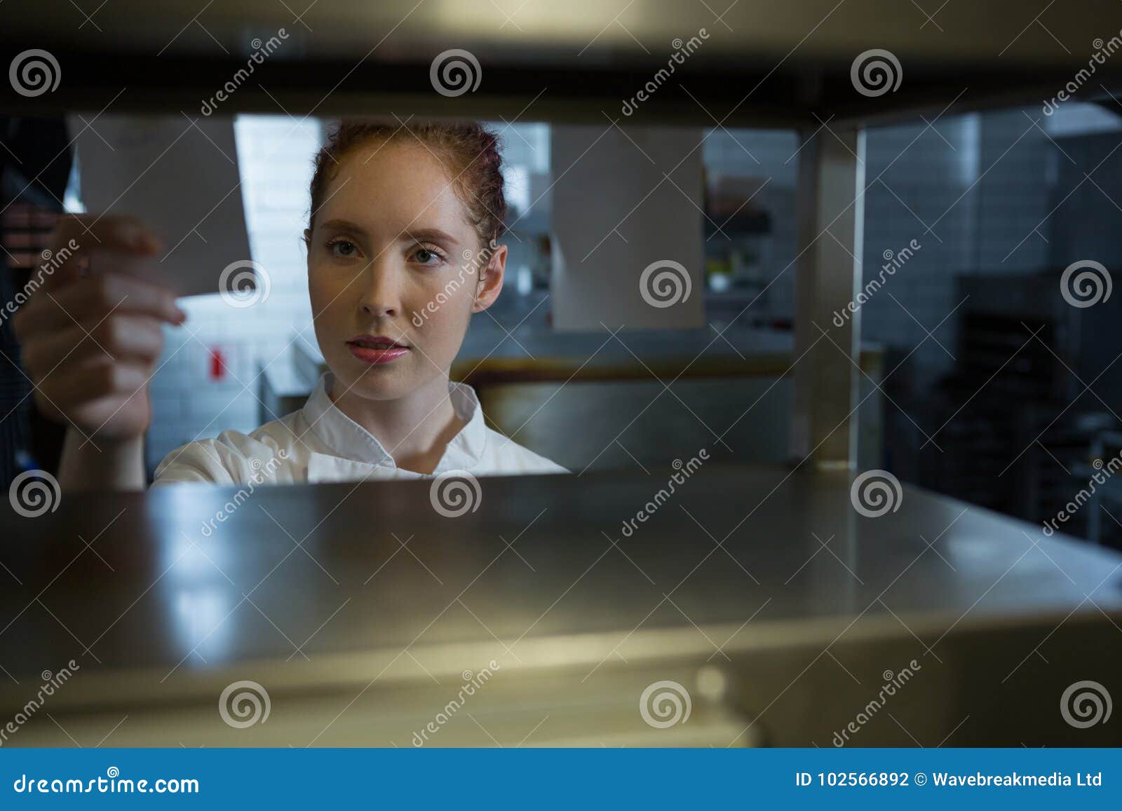Female chef reading order stock photo. Image of profession - 102566892