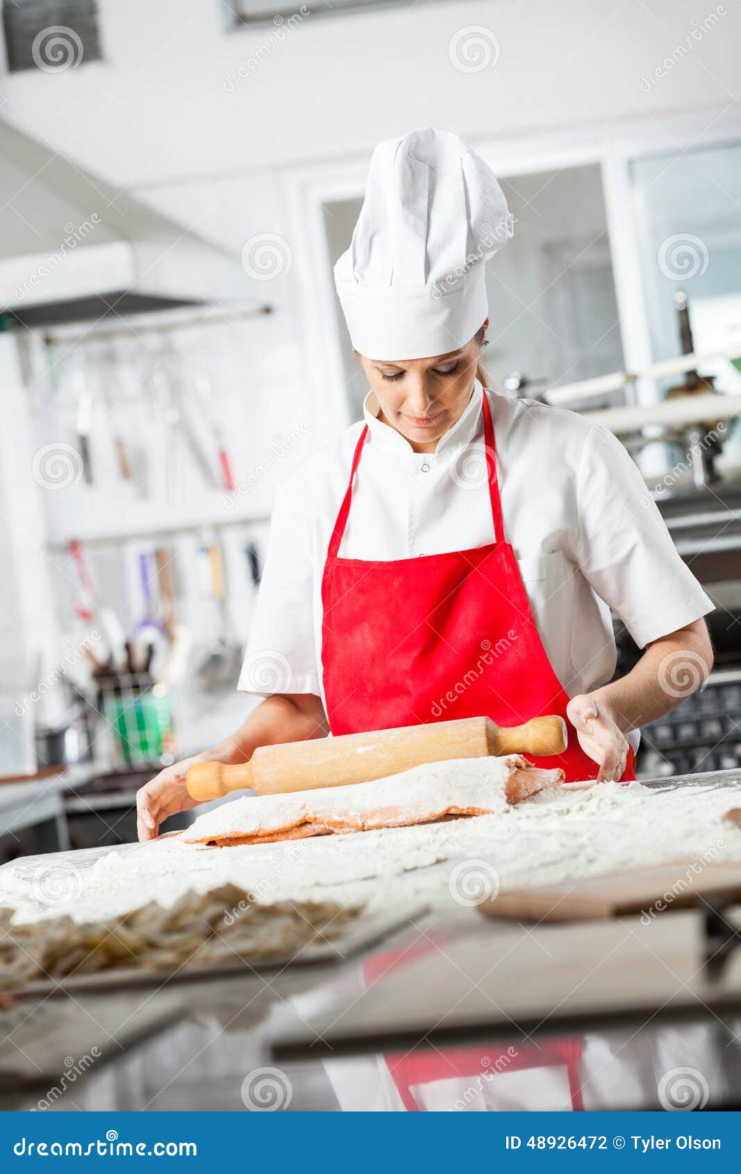 Female Chef Rolling Pasta Sheet Stock Photo - Image of commercial ...