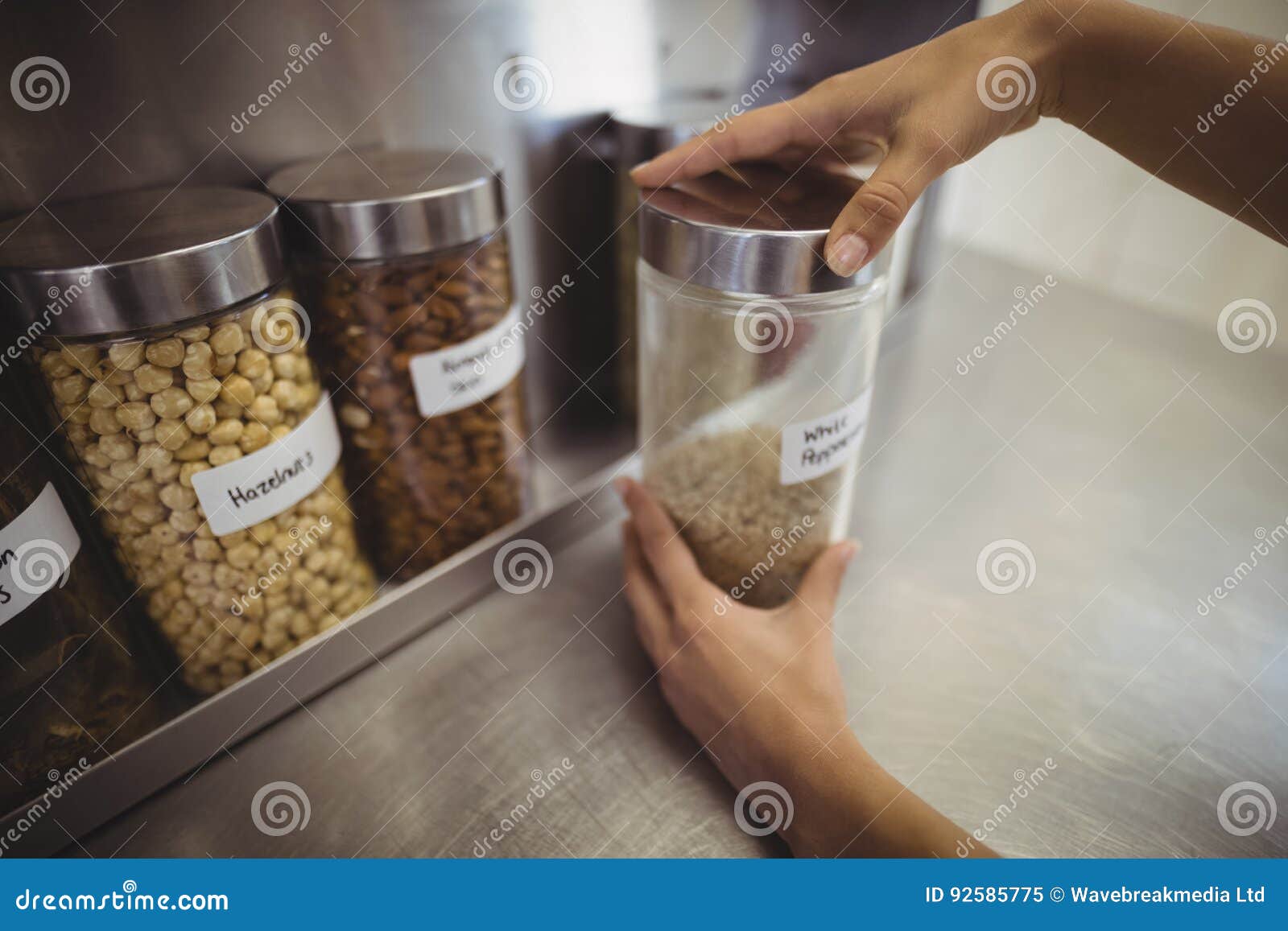 Female Chef Selecting a Spice Jar in the Commercial Kitchen Stock Image ...