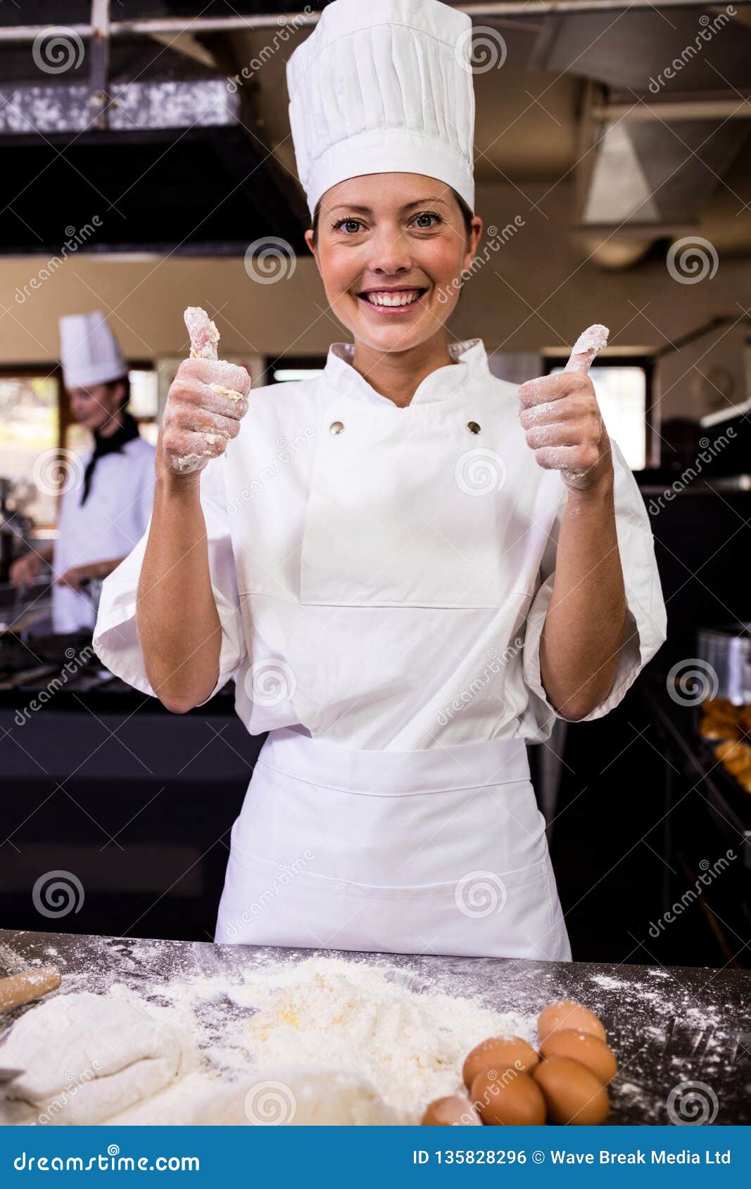 Female Chef Showing Thumbs Up in Kitchen Stock Photo - Image of chefs ...