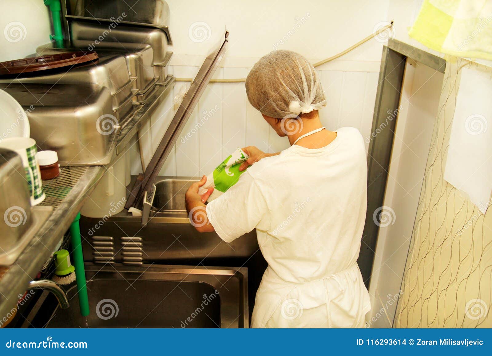 Female Chef and Worker is Working at Ice Cream Factory is Pouring ...