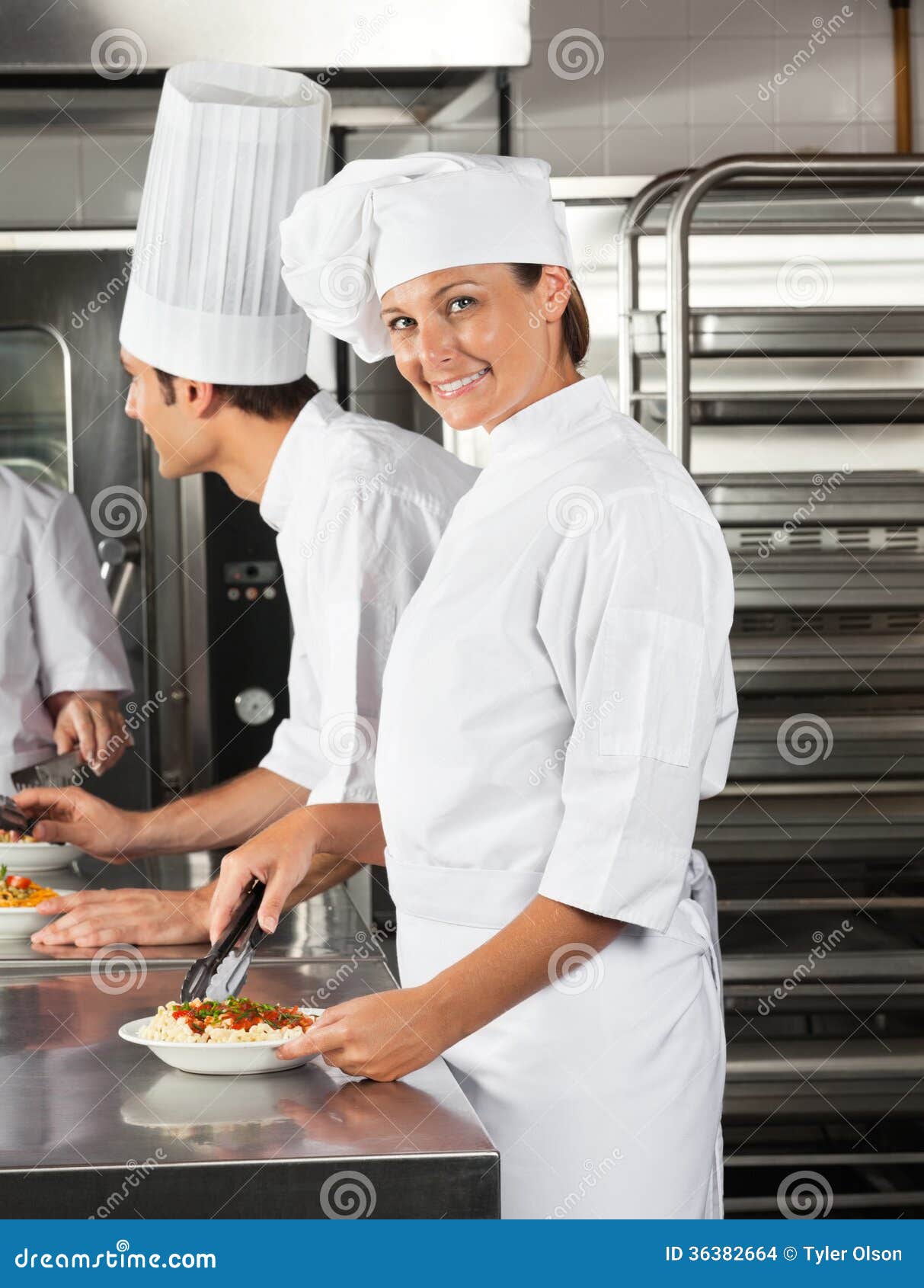 Female Chef Working in Restaurant Kitchen Stock Photo - Image of ...