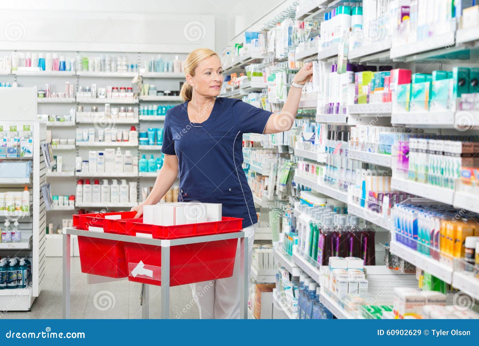 Female Chemist Arranging Products in Pharmacy Stock Image - Image of ...