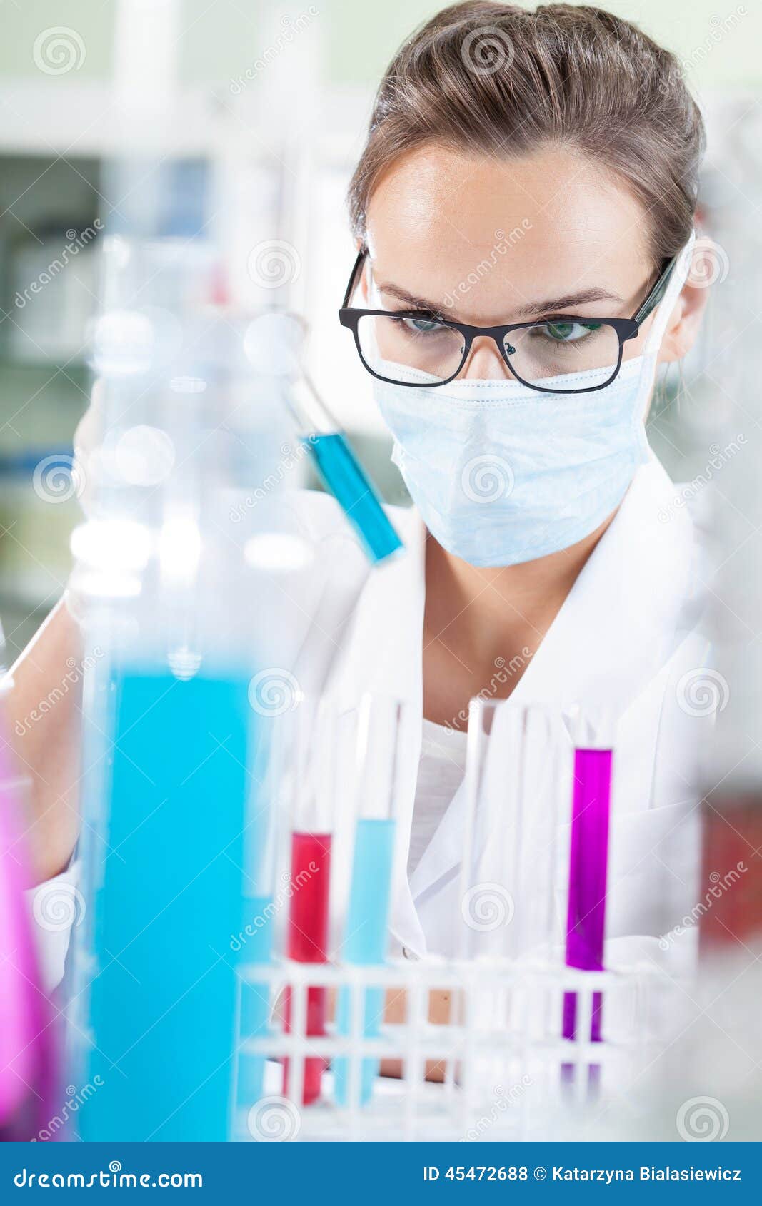 Female chemist in mask stock photo. Image of glasses - 45472688