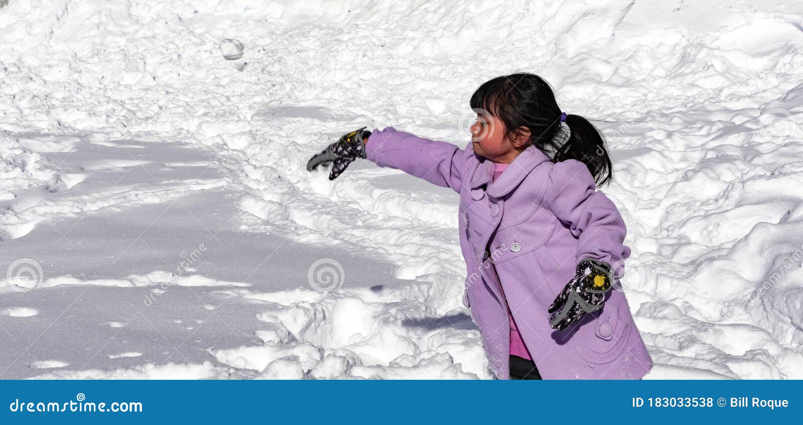 Female Child while Playing and Throwing Snow in a Ski Resort Stock ...