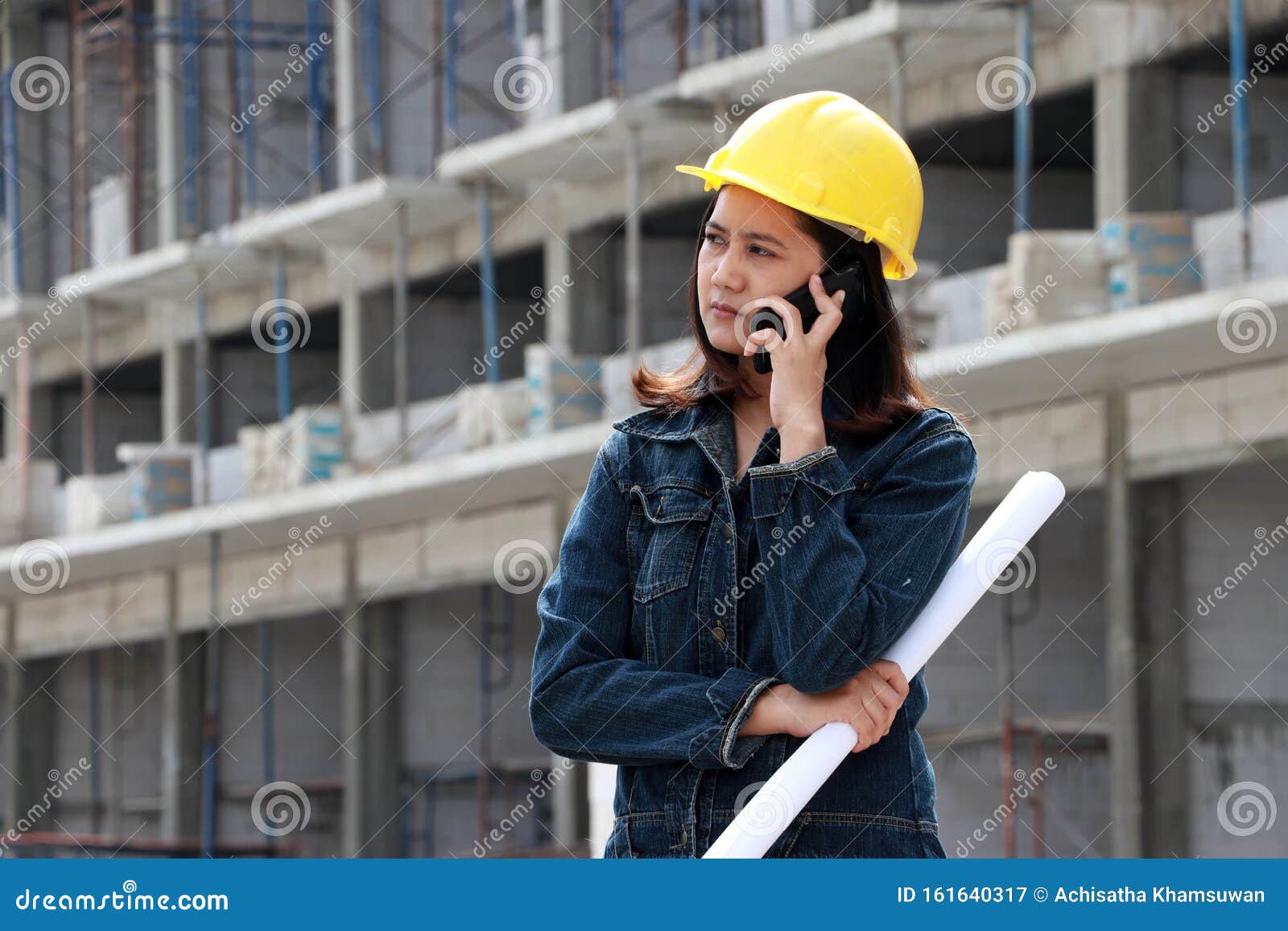 Female Civil Engineer or Architect with Yellow Helmet, Standing and ...