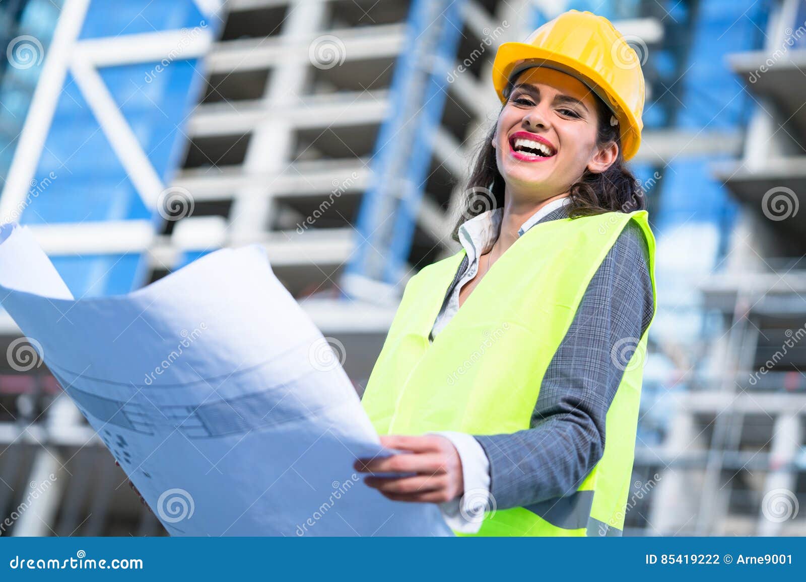Female Civil Engineer Studying Drafts Visiting Construction Site Stock ...