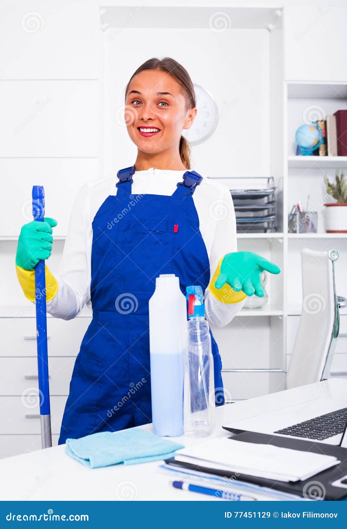 Female cleaner with duster stock image. Image of computer - 77451129