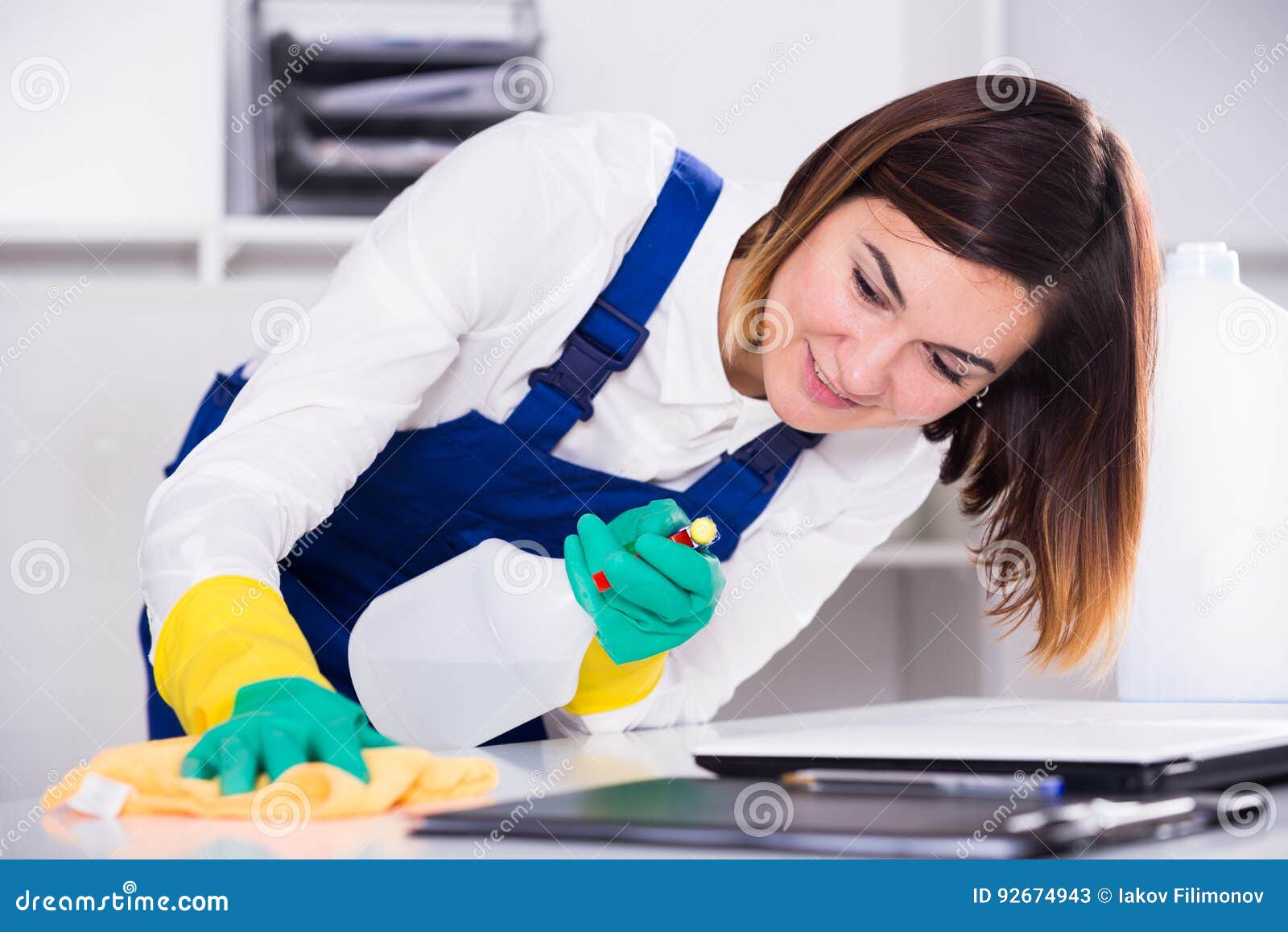 Female cleaner at work stock image. Image of assistance - 92674943