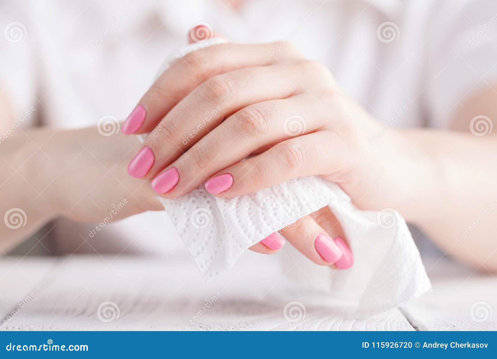 Female Cleaning His Hand with Tissue on White Background Stock Photo ...