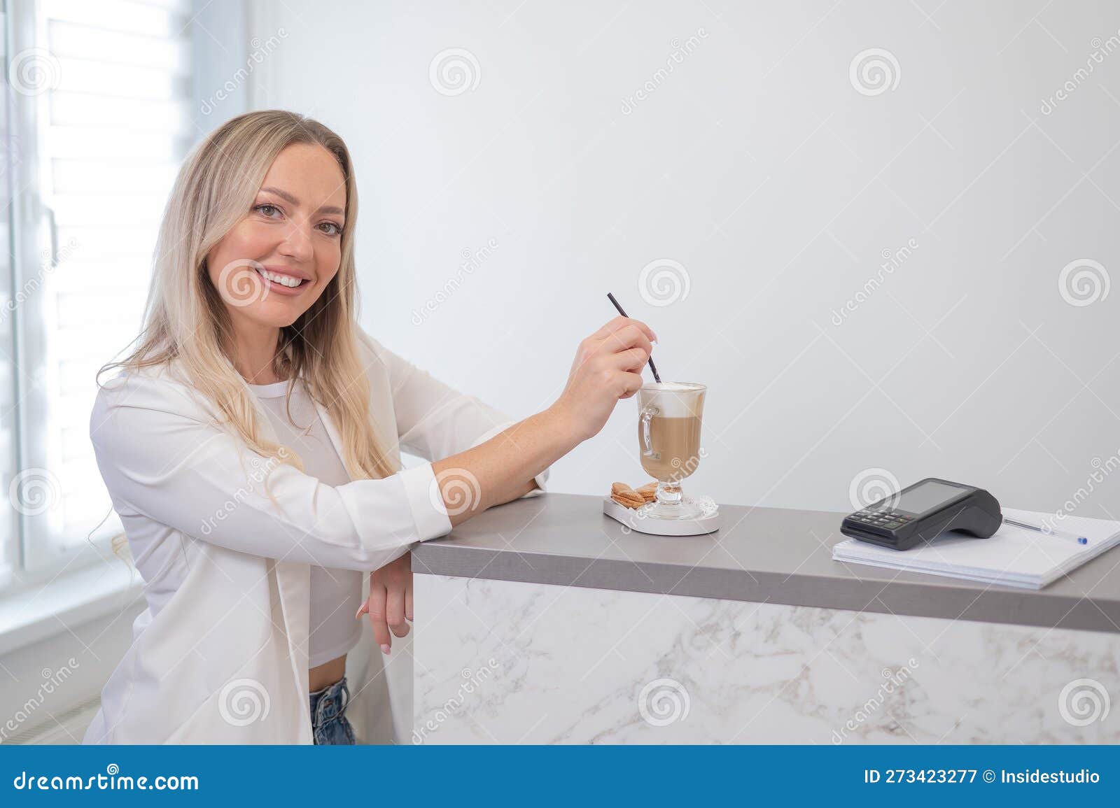 Female Client of a Beauty Salon Drinking Coffee at the Reception Desk ...