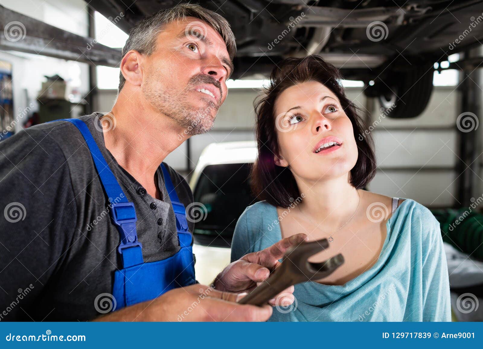 Client and Mechanic Checking Defects in the Car Stock Image - Image of ...