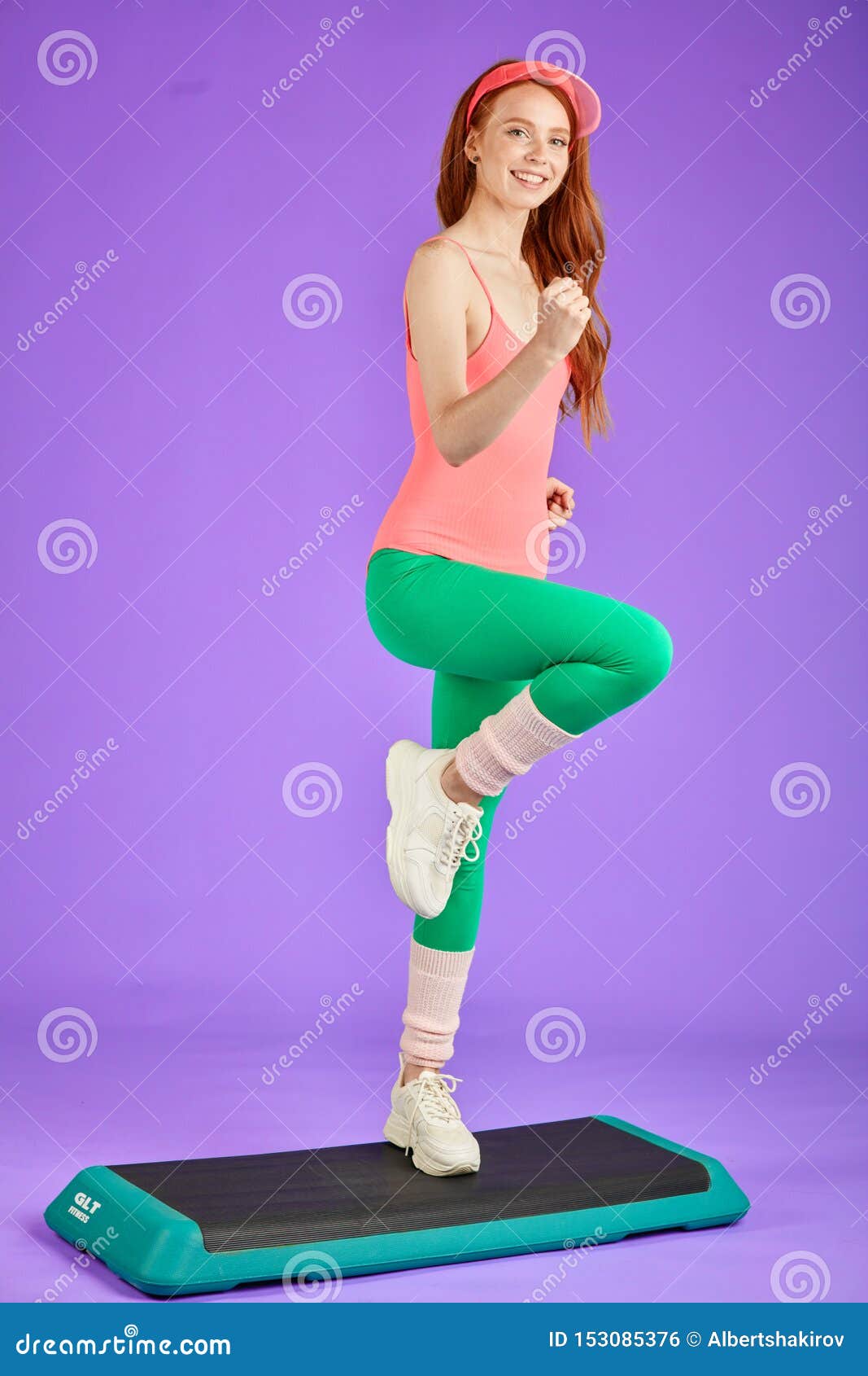 Female Fitness Coach Photographed in Motion Doing Active Steps on Step ...