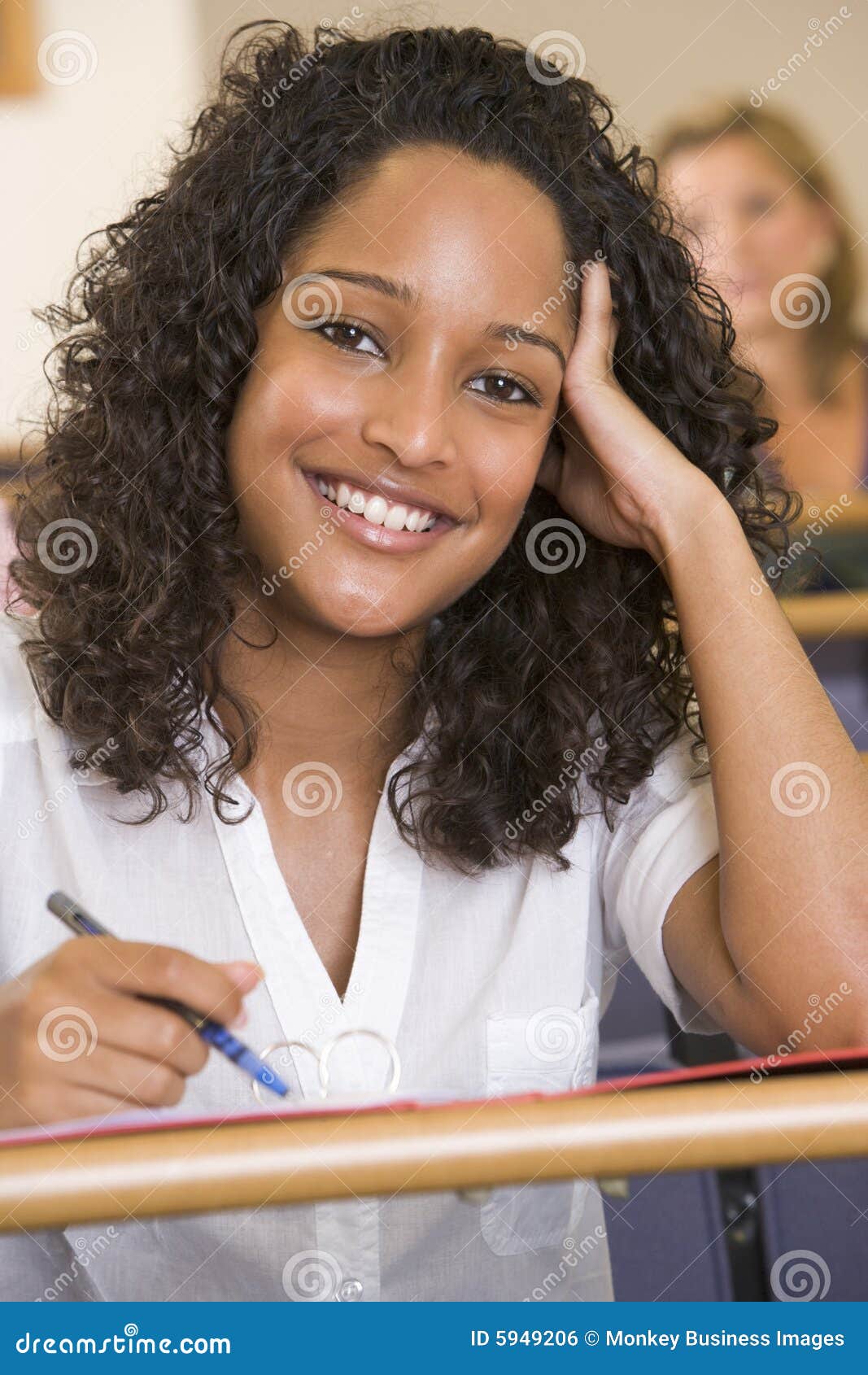 Female College Student Listening To a Lecture Stock Photo - Image of ...