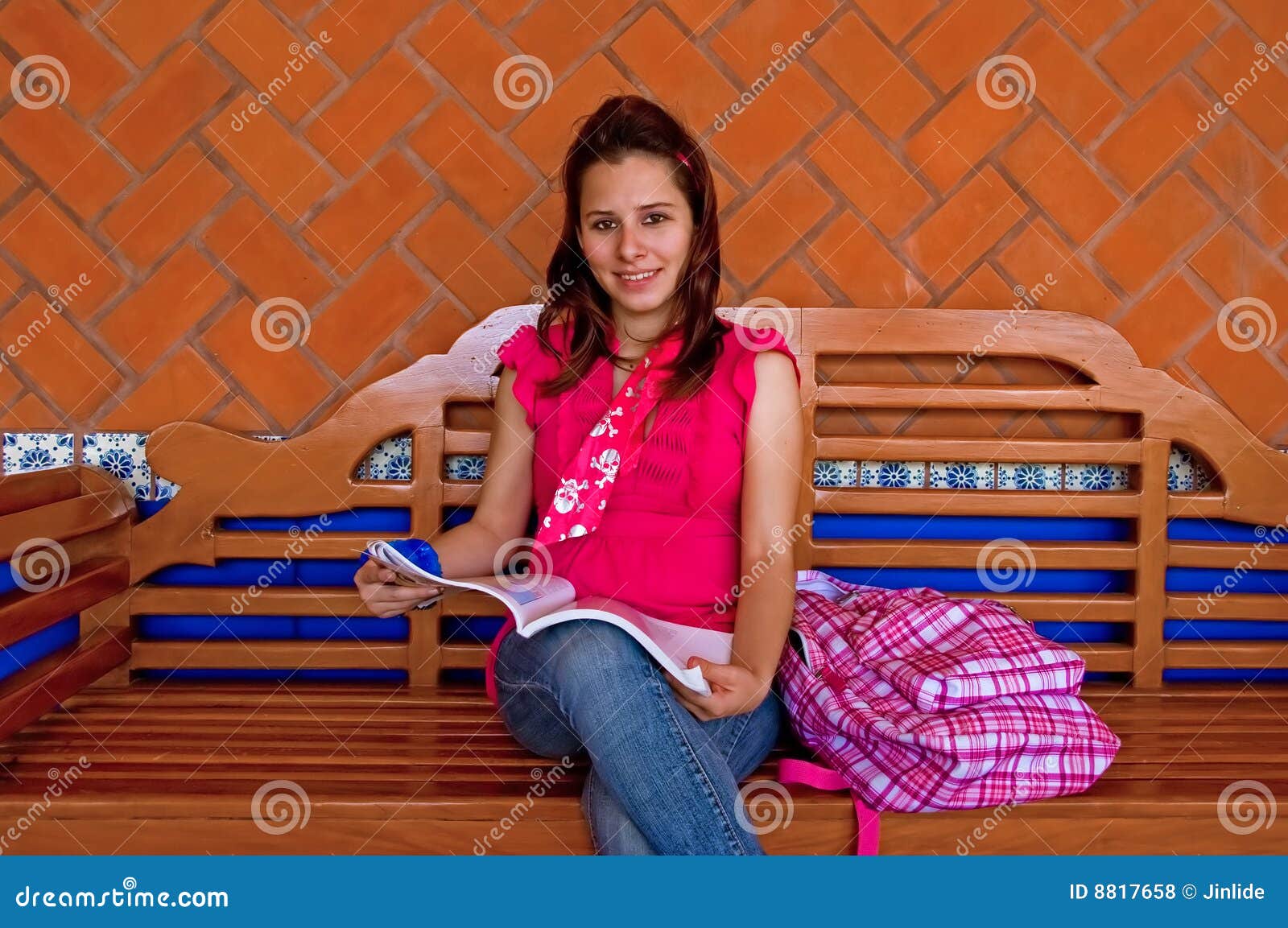 Female College Student Reading on Long Bench Stock Photo - Image of ...