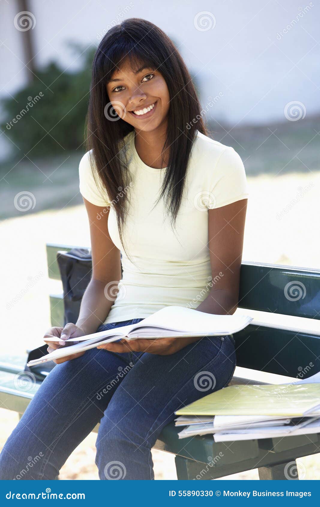 Female College Student Sitting on Bench with Book Stock Photo - Image ...