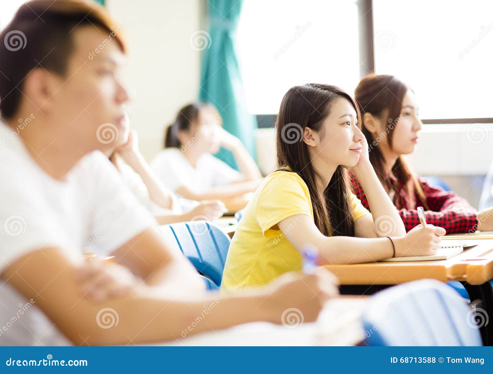 Female College Student Sitting with Classmates Stock Photo - Image of ...