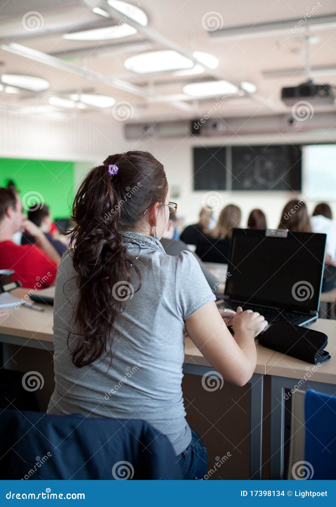 Female College Student Sitting in a Classroom Stock Photo - Image of ...