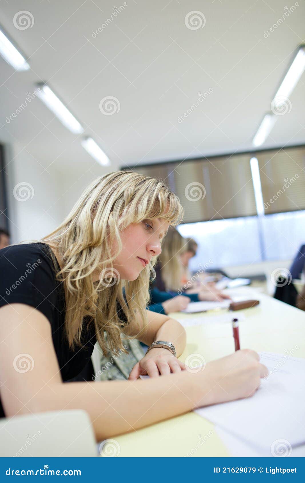 Female College Student Sitting in a Classroom Stock Image - Image of ...