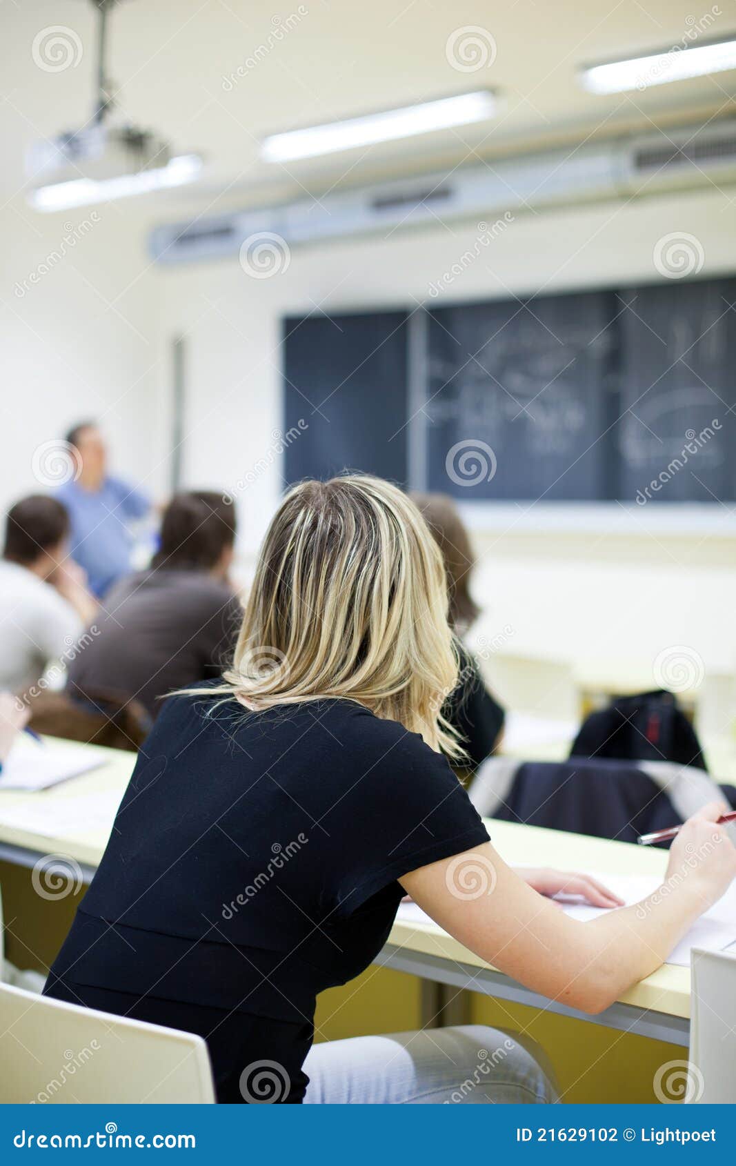 Female College Student Sitting in a Classroom Stock Photo - Image of ...