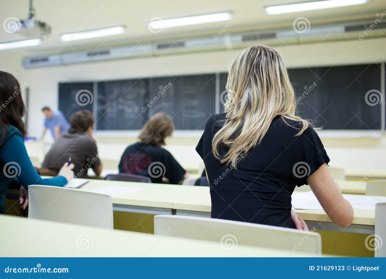 Female College Student Sitting in a Classroom Stock Image - Image of ...