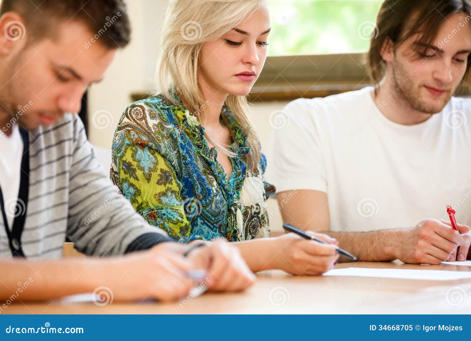 Female College Student Sitting in a Classroom Stock Image - Image of ...