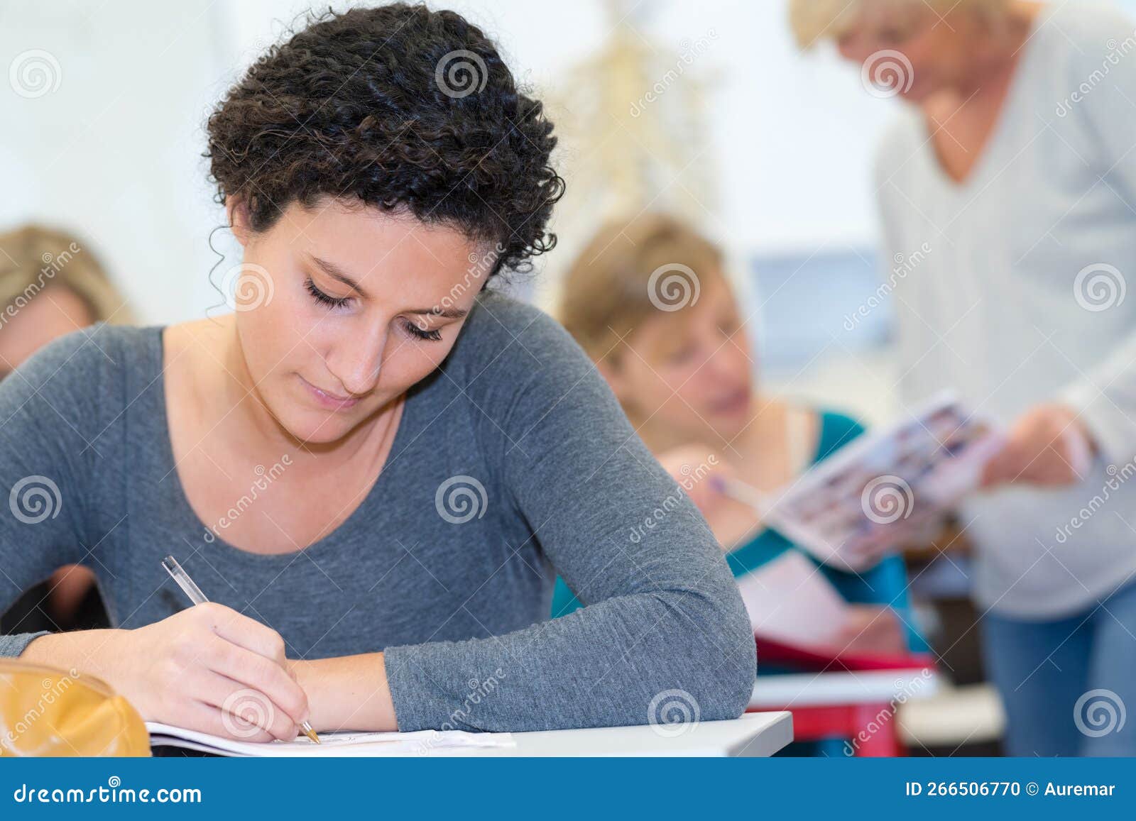 Female College Student Sitting and Exam in Classroom Stock Photo ...