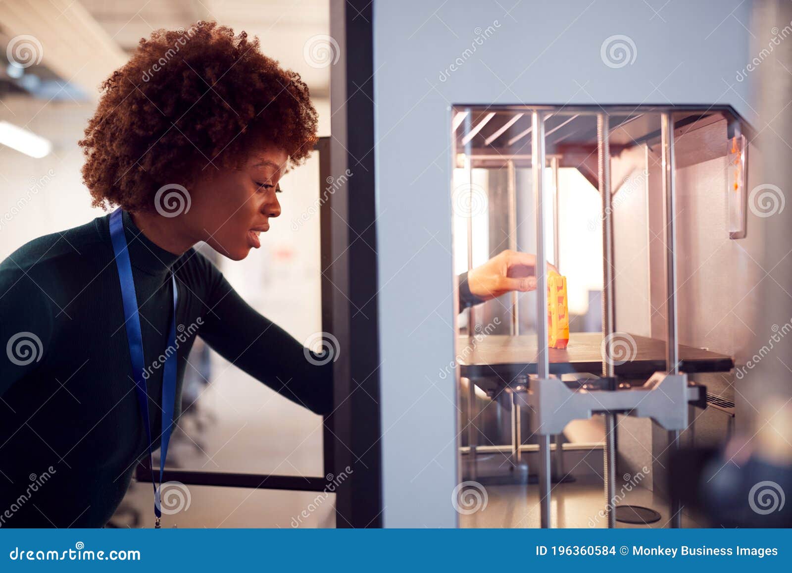 Female College Student Studying Engineering Using 3D Printing Machine ...
