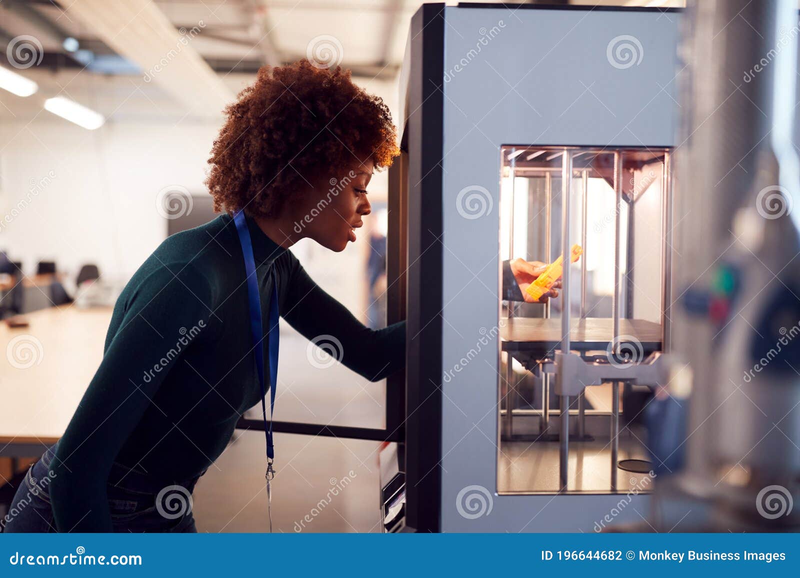 Female College Student Studying Engineering Using 3D Printing Machine ...