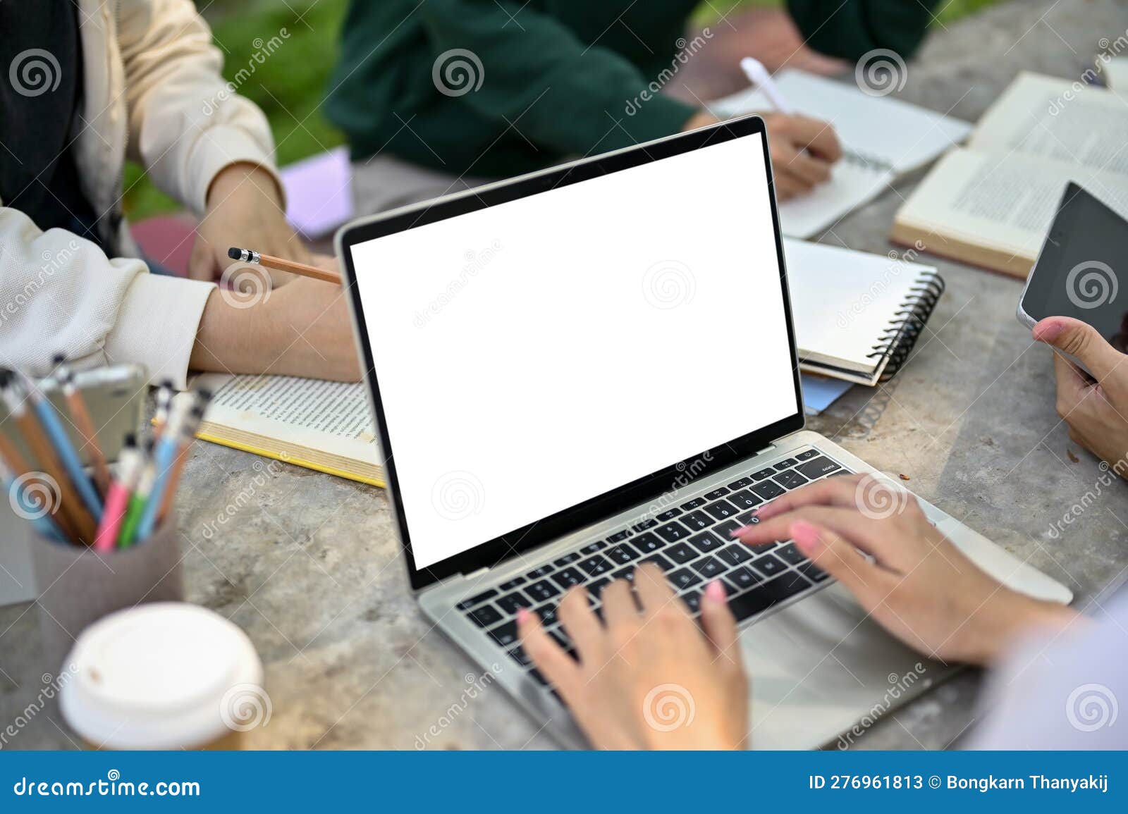 A Female College Student Using Her Laptop and Doing a School Project ...