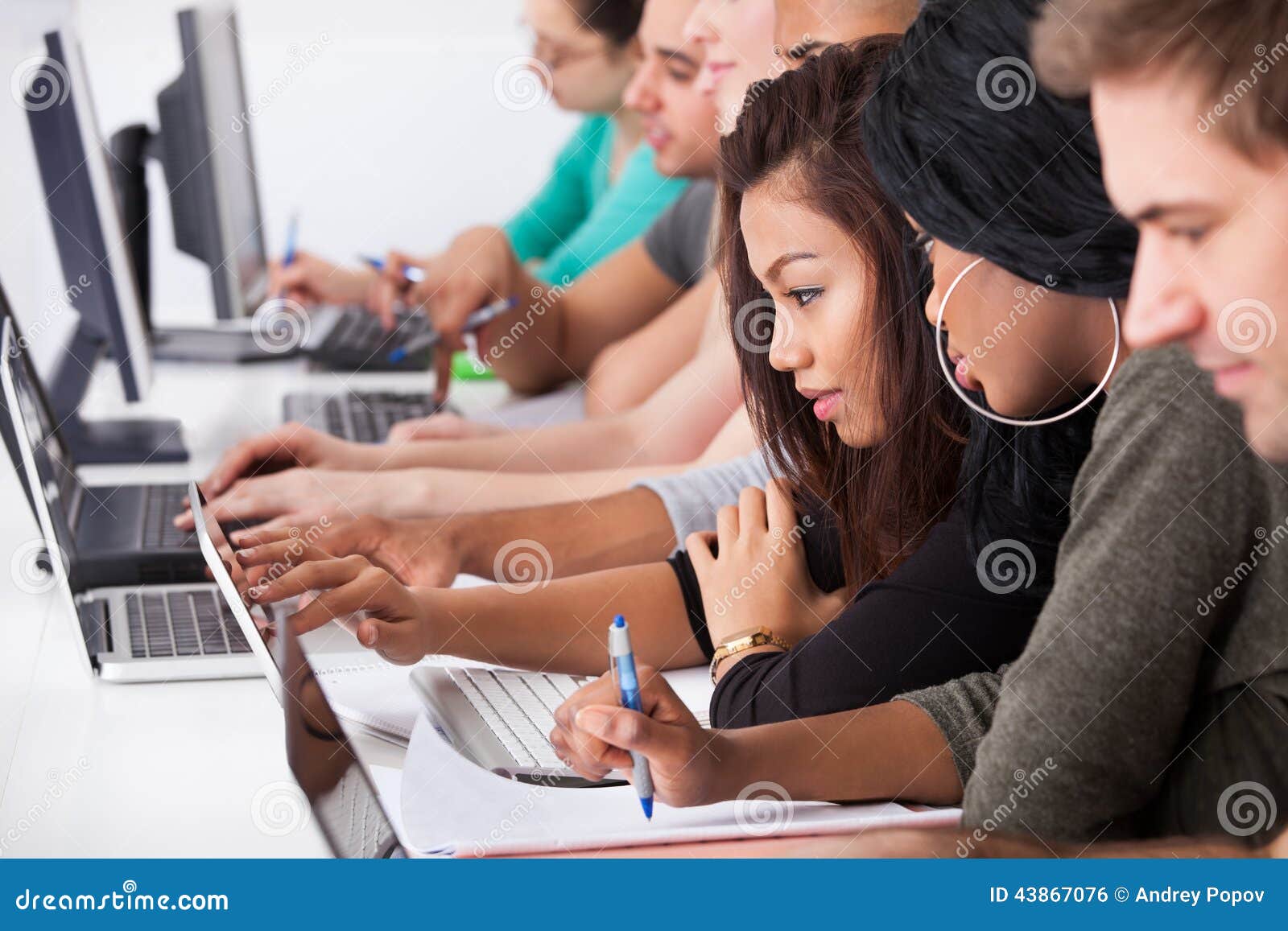 Female College Students Using Laptop at Desk Stock Photo - Image of ...